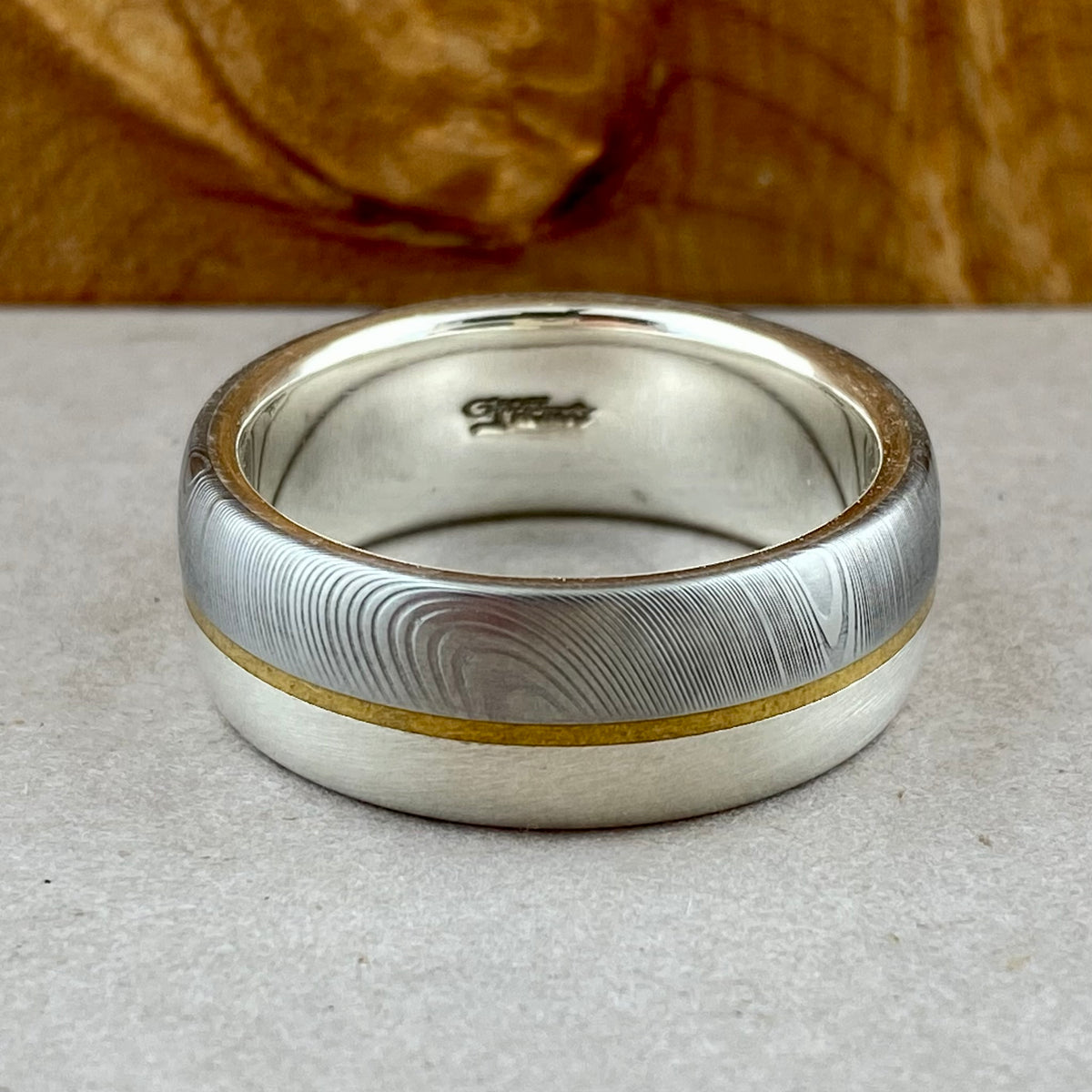 Damascus band on Sterling w Brass Strip sz12 – Geoff Thomas Designs