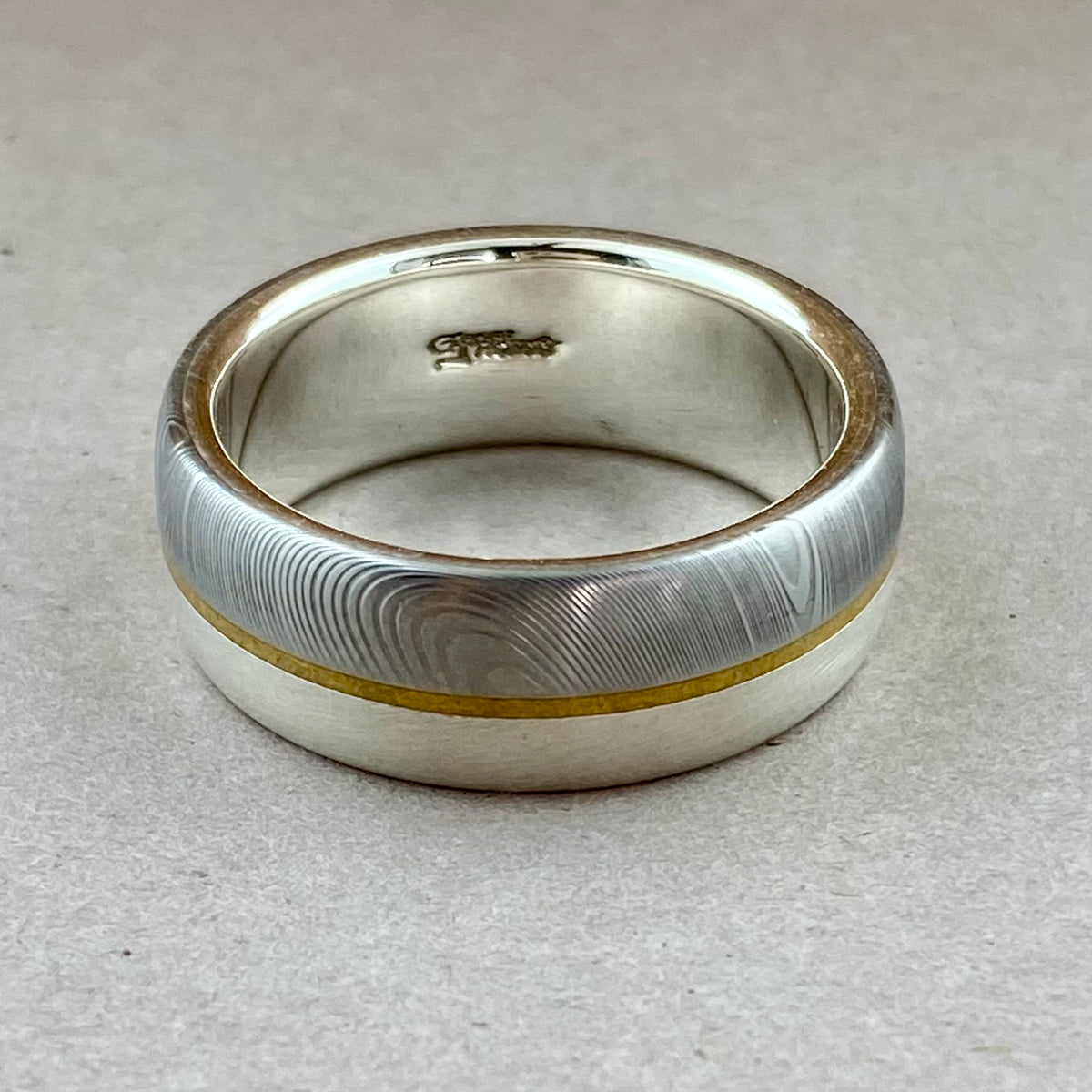 Damascus band on Sterling w Brass Strip sz12 – Geoff Thomas Designs